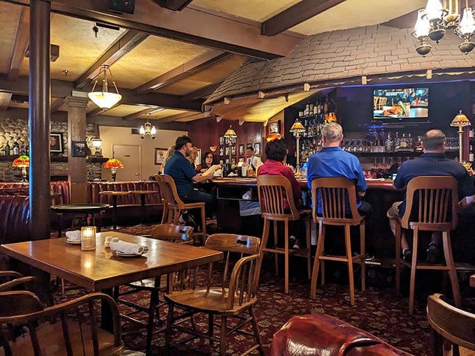The bar area hums with the timeless energy of good conversation, proving some things—like enjoying drinks with friends—never go out of style.