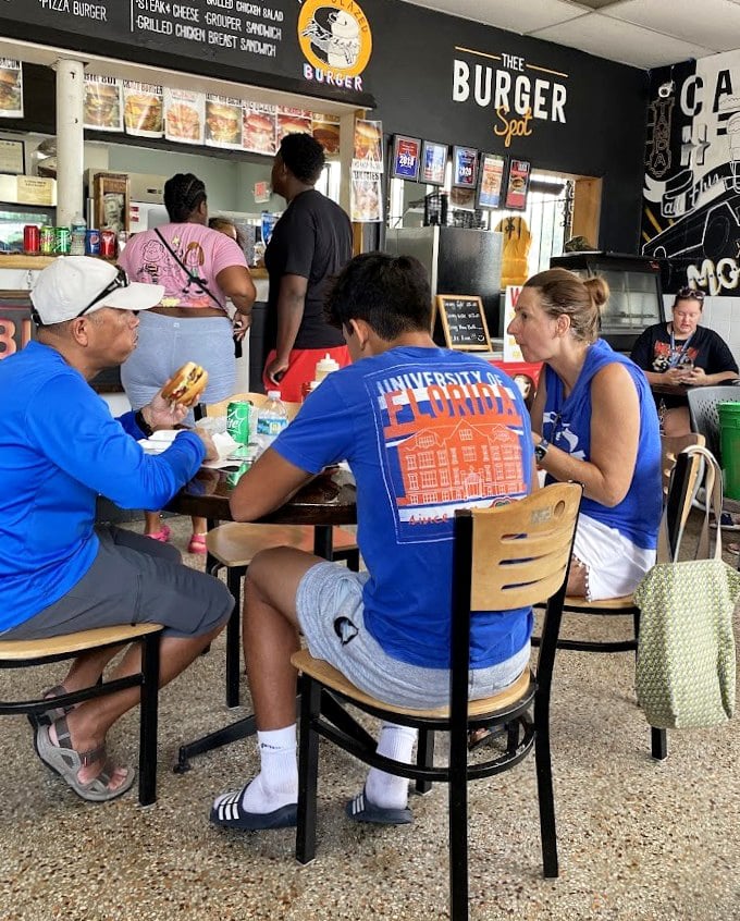 The true measure of a local spot: University of Florida shirts, animated conversations, and the unmistakable look of people who know they've found food nirvana.