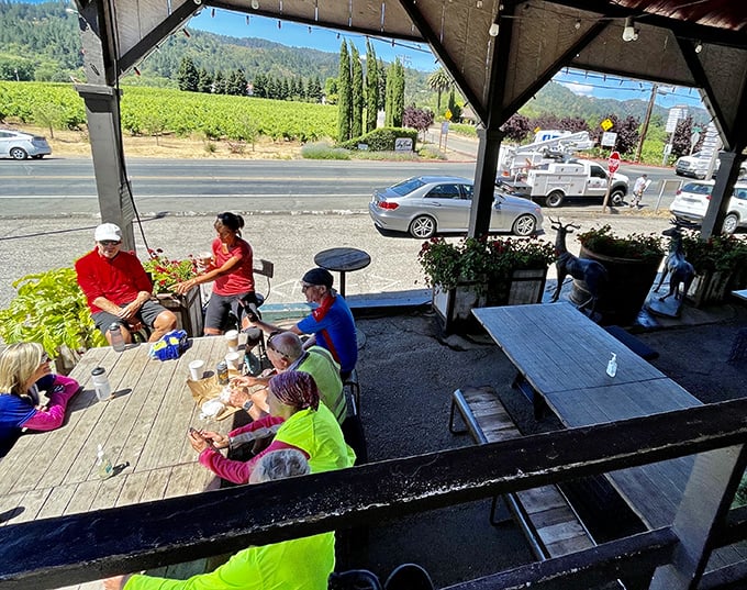 The outdoor seating area offers vineyard views that pair perfectly with sandwiches, turning lunch into what vacation memories are made of.