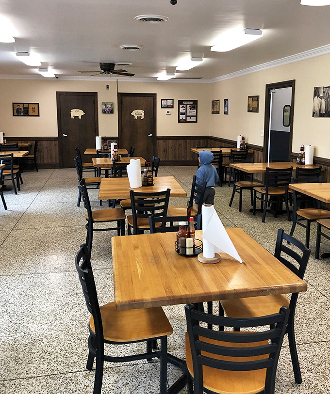 Simple wooden tables that have witnessed countless barbecue epiphanies and the silent nods of appreciation that follow that first perfect bite.