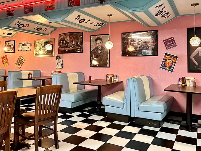 The dining area's retro booths and vintage memorabilia create the perfect backdrop for conversations that somehow feel more meaningful under the glow of neon.