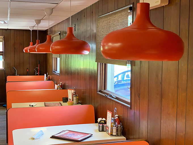 Those orange pendant lamps have witnessed decades of first dates, family celebrations, and "just because it's Tuesday" meals.