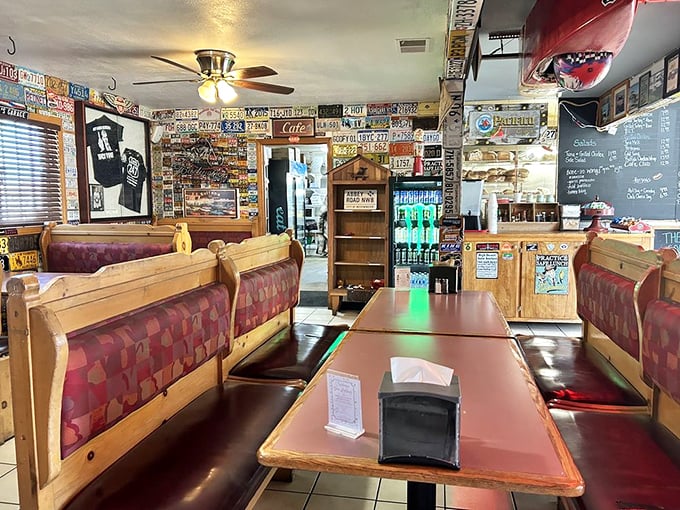 The dining room feels like a community scrapbook come to life, where every inch tells a story of travelers who came, ate, and conquered.