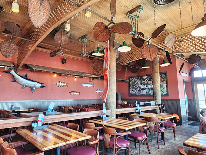 Vintage ceiling fans, wooden beams, and fish mounted on coral-colored walls—it's like dining inside the world's most delicious fishing boat.
