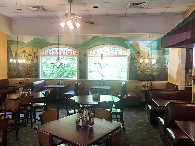Plaid wallpaper and wooden chairs create that perfect "your Italian friend's dining room" vibe—comfortable enough to linger, charming enough to remember. 