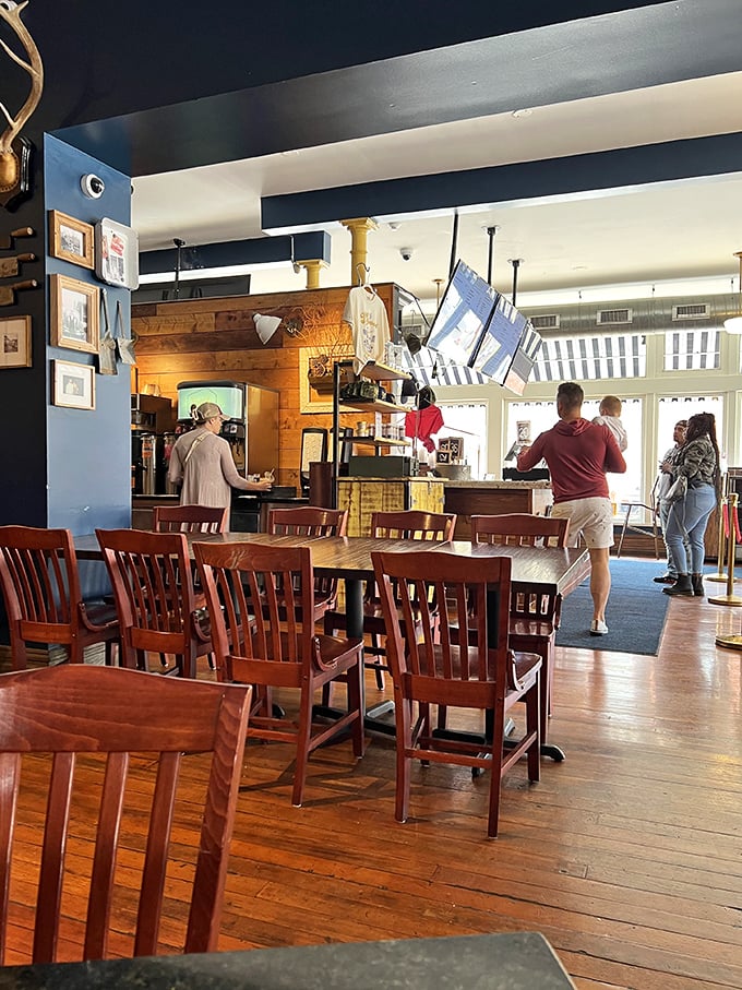 Wooden chairs, blue walls, and natural light create the perfect stage for the real stars—the plates of Southern goodness that will soon grace these tables.