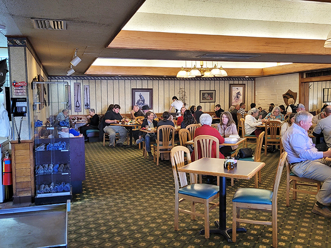 The dining room hums with the universal language of satisfaction. Every table tells a story, every bite creates a memory.