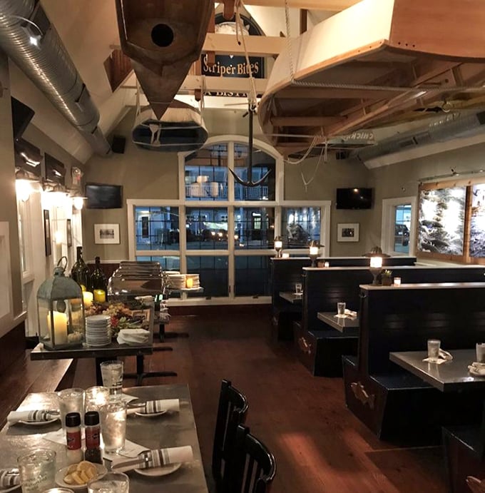 Evening transforms the dining room into a maritime sanctuary where conversations flow as smoothly as the local brews.