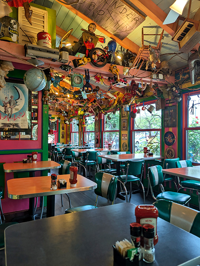 The dining area looks like what would happen if Willy Wonka designed a 1950s diner. Every inch tells a different story.