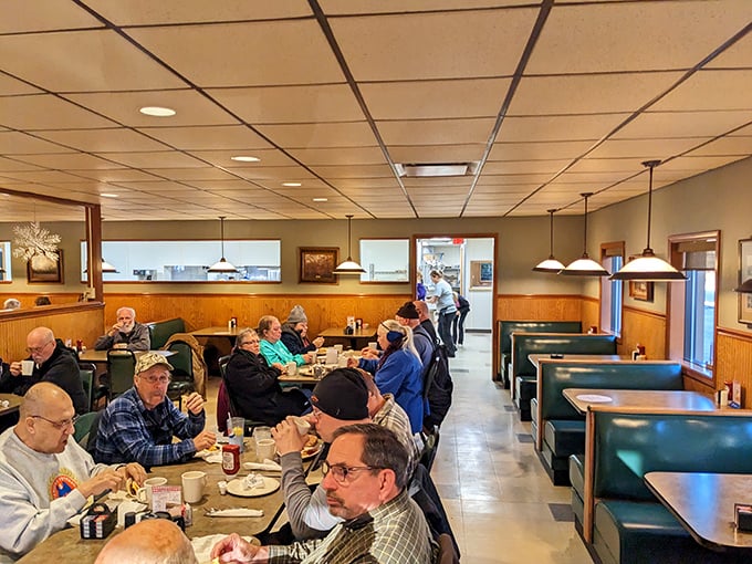 The dining area hums with conversation and the clink of silverware. These booths have witnessed first dates, family celebrations, and countless "just one more bite" moments.