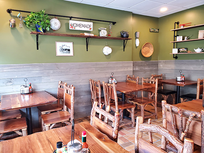 Green walls adorned with vintage kitchenware create that rare dining atmosphere—homey without trying too hard, like your favorite aunt's kitchen.
