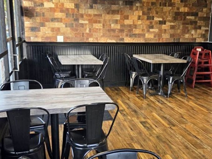Industrial-chic simplicity defines the dining area, where nothing distracts from the main event. These tables have witnessed countless moments of burger bliss.