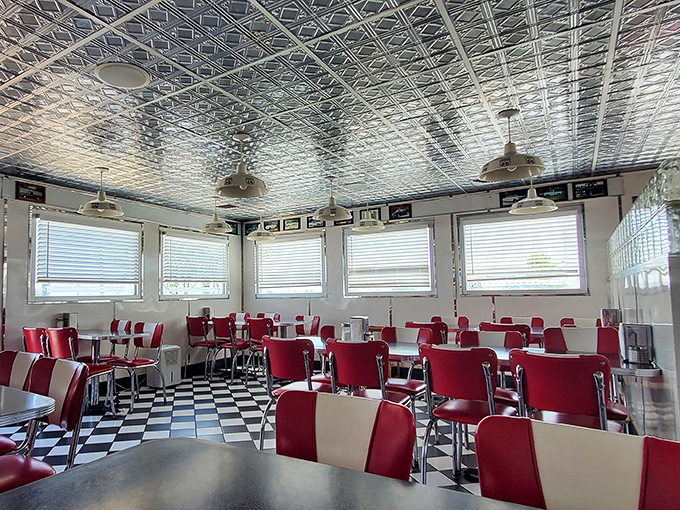 The dining room looks like it was designed by someone who said, "Make it feel like 1955, but with better lighting." Mission accomplished.