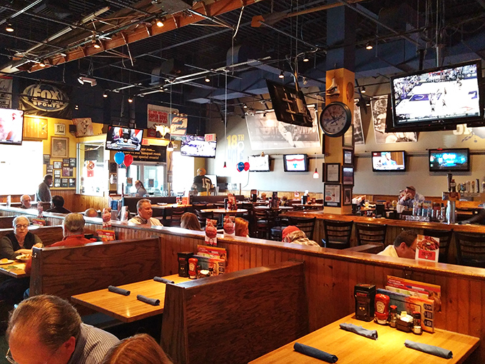 The dining area buzzes with conversation and camaraderie. Every screen offers a different game, but the food is what really scores.