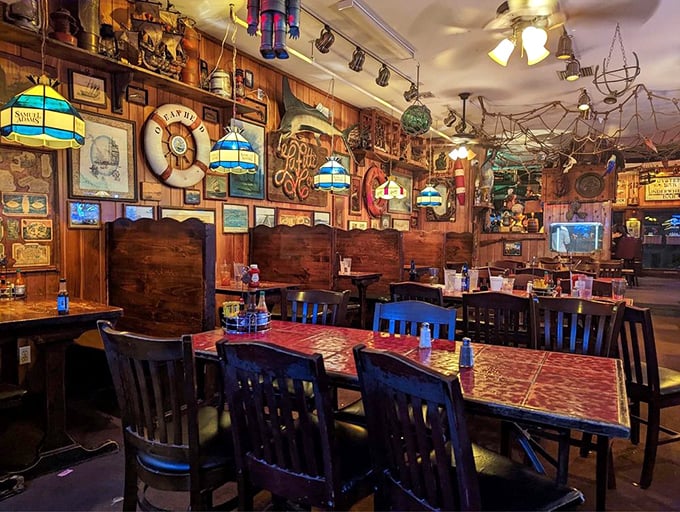 Wooden booths and nautical treasures create the feeling you've stumbled into the world's coziest shipwreck—one with excellent lighting.