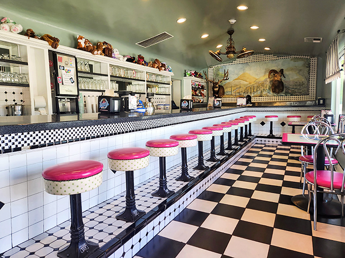 Those pink stools aren't just seating—they're front-row tickets to the greatest show in Bakersfield: the art of classic soda fountain service.