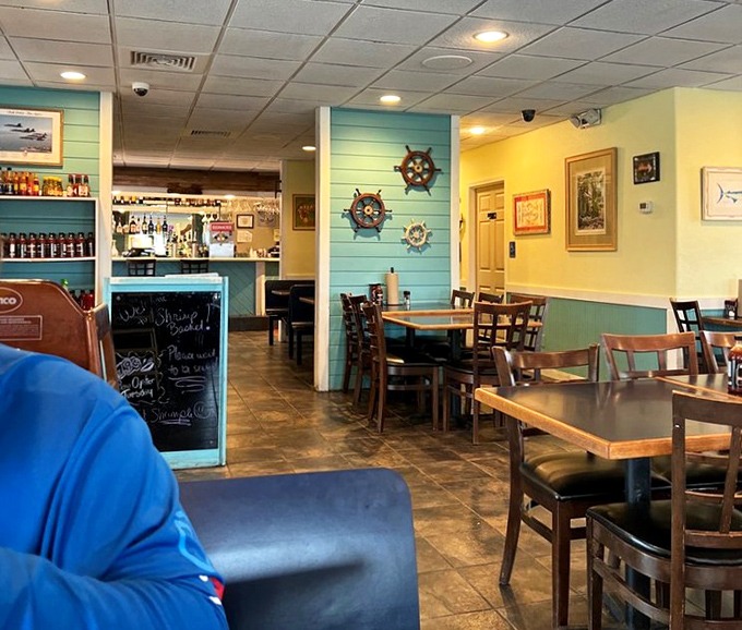 Light blue walls and ship wheels create that "coastal casual" vibe where flip-flops are welcome and seafood stories get better with each telling.