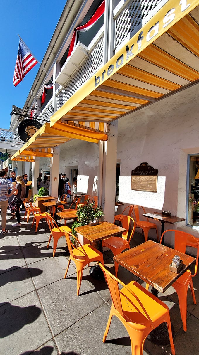 The outdoor seating area doesn't just offer tables—it offers front-row tickets to the charming street theater of Sonoma Plaza life.