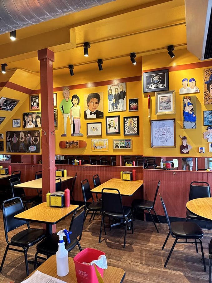 Yellow walls adorned with quirky art create the perfect backdrop for hot dog enlightenment—part gallery, part comfort food sanctuary.