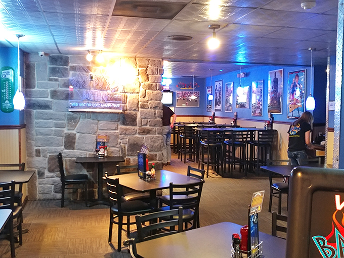 Stone walls and blue lighting create that perfect "escape from reality" atmosphere where food becomes an event worth savoring.