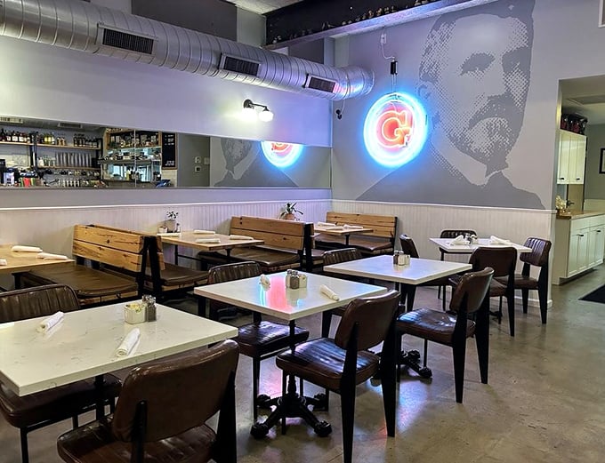 Modern diner aesthetics with a touch of artistic flair. The neon "G" sign casts a warm glow over wooden booths where food dreams come true.
