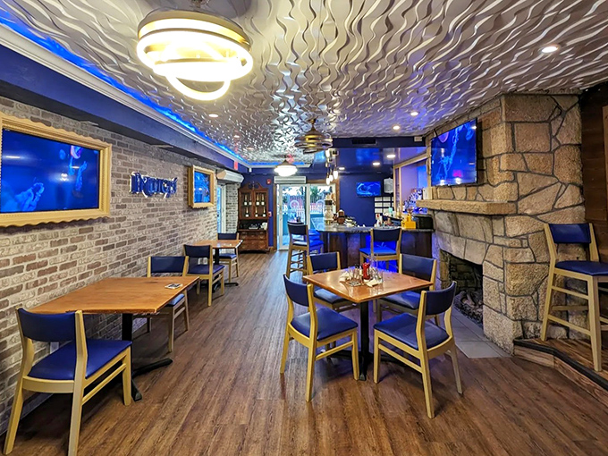 Modern meets coastal in this stylish dining space. The undulating ceiling catches light like water while stone and wood elements ground the experience.