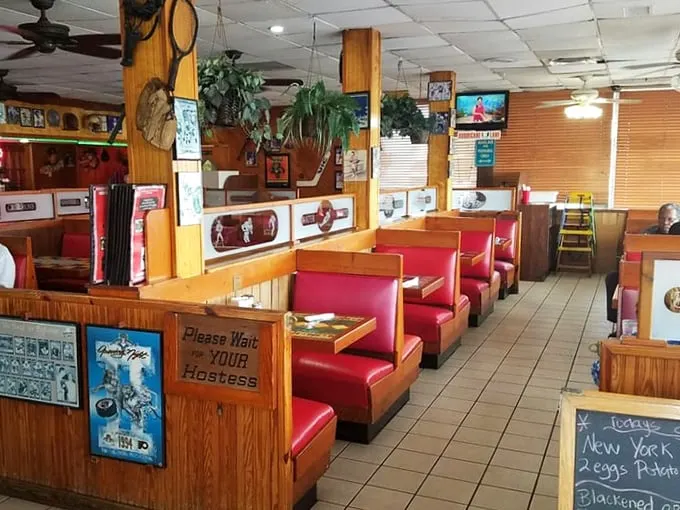 The dining area feels like a time capsule of American comfort—where every red booth has hosted countless conversations and food epiphanies.
