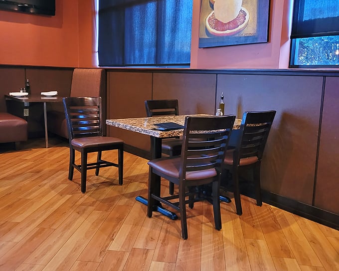 Cozy booths and granite tables create an atmosphere where every meal feels like a celebration worth savoring slowly.