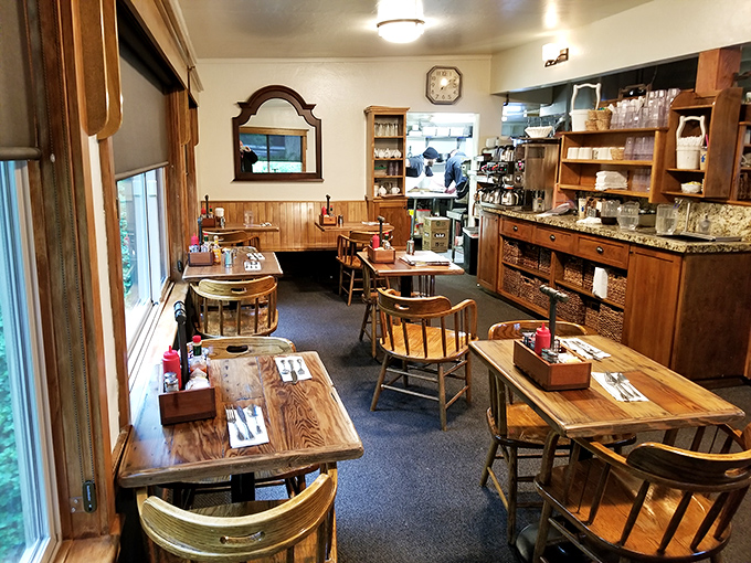 Wooden tables bathed in natural light create the stage where breakfast dreams come true. No fancy tablecloths needed when the food is this good.