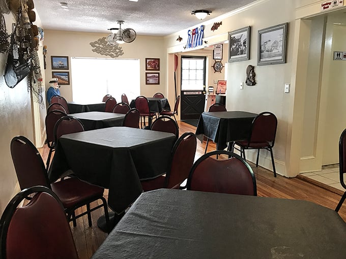 Simple tables draped in black cloths await seafood pilgrims, while nautical décor watches over like guardian angels of good taste.