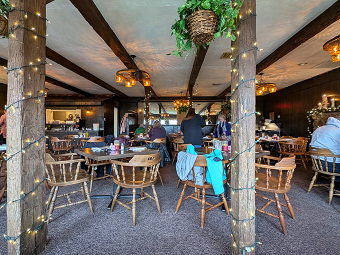 The dining room where wooden posts wrapped in twinkling lights create an atmosphere that says, "Stay awhile—calories consumed under fairy lights don't count."