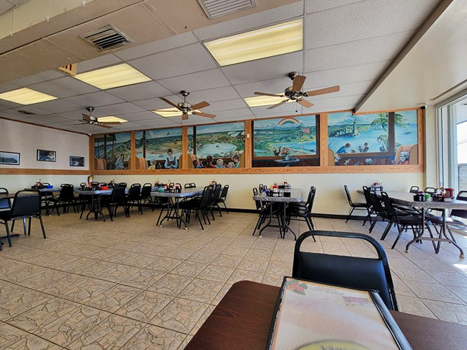 The dining area's mural tells the story of Keys life while ceiling fans keep the tropical air moving – visual appetizers before the main event arrives.