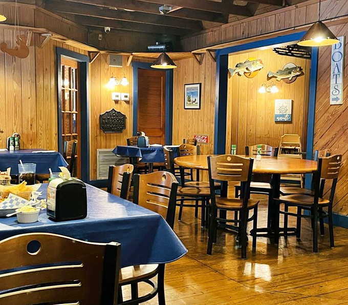 Blue tablecloths against honey-colored wood paneling—like dining inside a ship's cabin, minus the seasickness and with better food.