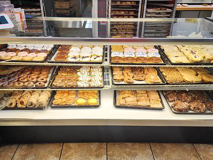 The display case at Milton's: where dreams come true and diets go to die. Each tray holds a different path to happiness.