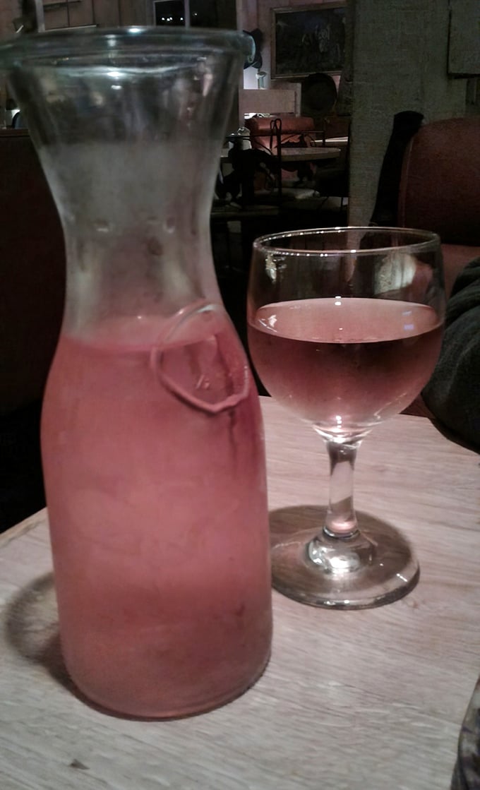 House wine served in unpretentious carafes—because sometimes the perfect pairing for great steak is simply whatever makes you happy.
