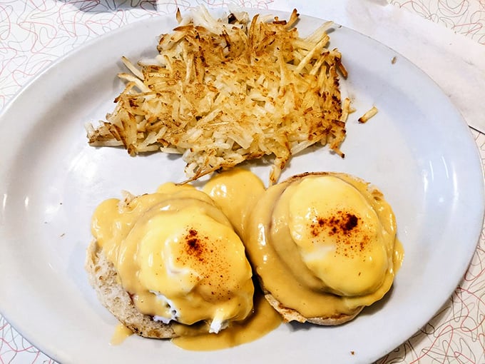 Eggs Benedict: where hollandaise sauce flows like liquid gold over English muffins. Breakfast doesn't get more indulgent than this morning masterpiece.