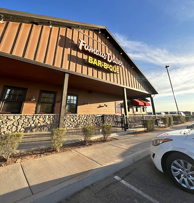 Famous Dave's rustic exterior hints at the smoky delights within – nothing says "vacation mode" quite like barbecue sauce on your chin.
