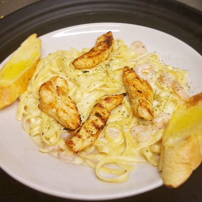 Pasta meets the ocean in this creamy fettuccine topped with perfectly grilled shrimp—carb heaven with a coastal upgrade.