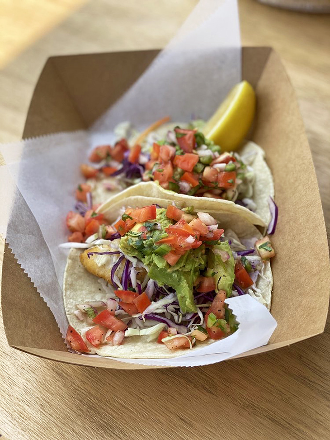 Fish tacos that don't need a beach view to transport you to coastal paradise – though the extra napkins are non-negotiable.