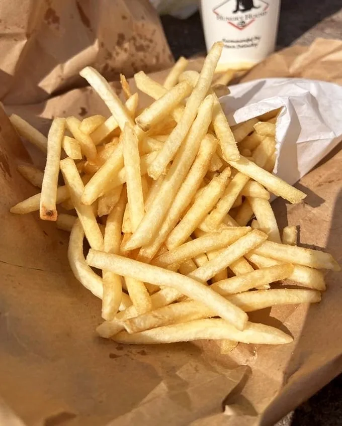 These aren't fancy truffle fries with aioli. These are honest-to-goodness potato sticks—golden, salty vehicles for any remaining beef jus.