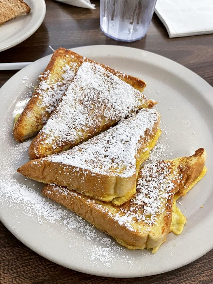 French toast that's crossed the line from breakfast to dessert territory—powdered sugar snowfall included. No judgment if you order this at 2pm.