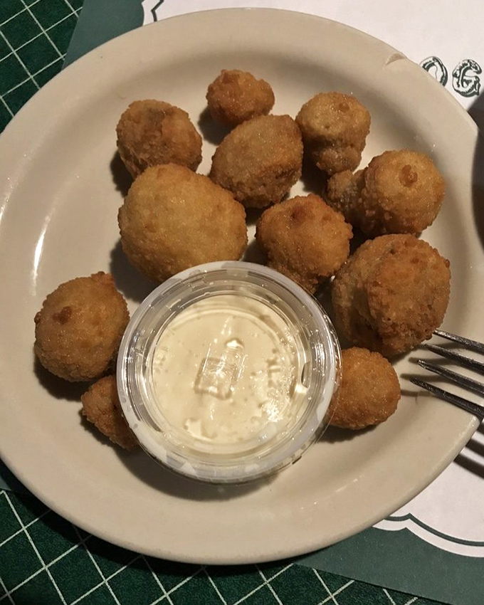 These aren't just any fried mushrooms – they're little golden orbs of happiness that disappear from the plate with suspicious speed.