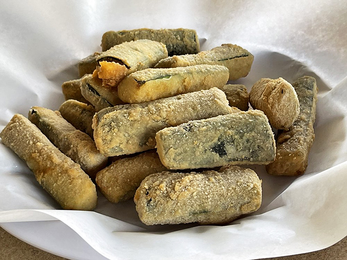Crispy zucchini sticks with that perfect golden coating—proof that vegetables can be just as indulgent as anything else on the menu.