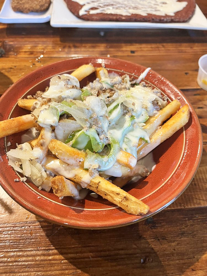 Loaded fries that blur the line between snack and meal. When potatoes meet toppings and melty cheese, resistance becomes futile.