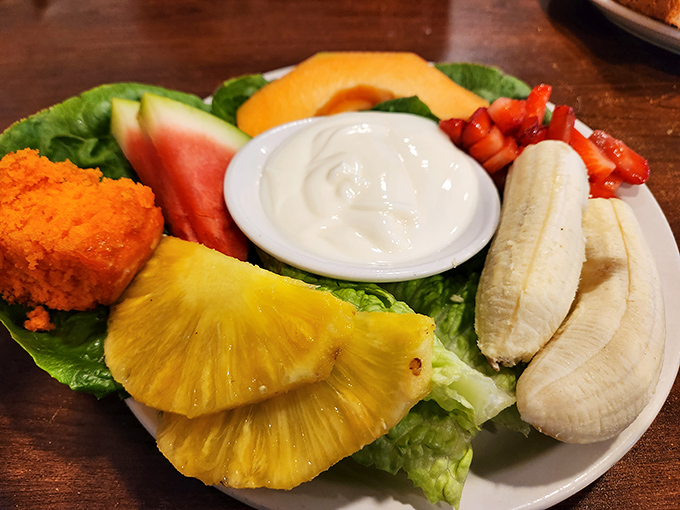A fruit plate that proves healthy eating doesn't have to be punishment—it can be a colorful celebration on a bed of crisp lettuce.