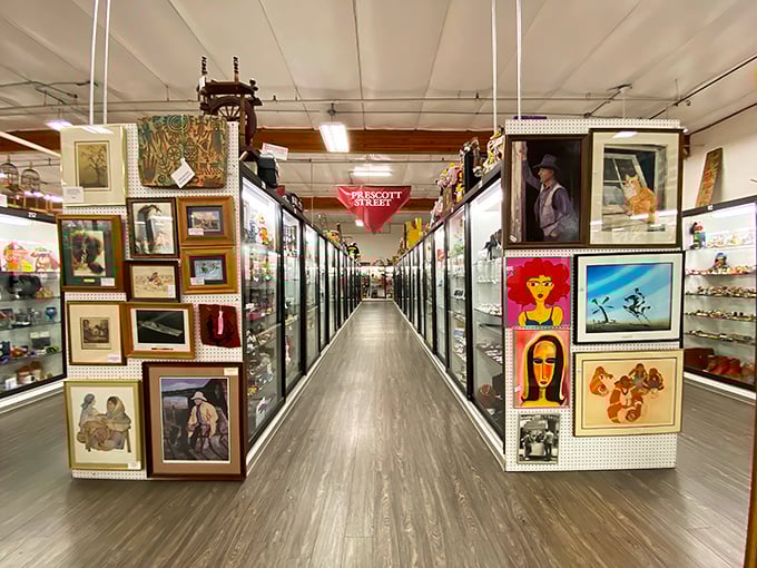 Artwork lines both sides of this pristine corridor, from kitschy pop art to elegant landscapes—a gallery where every piece is potentially yours.