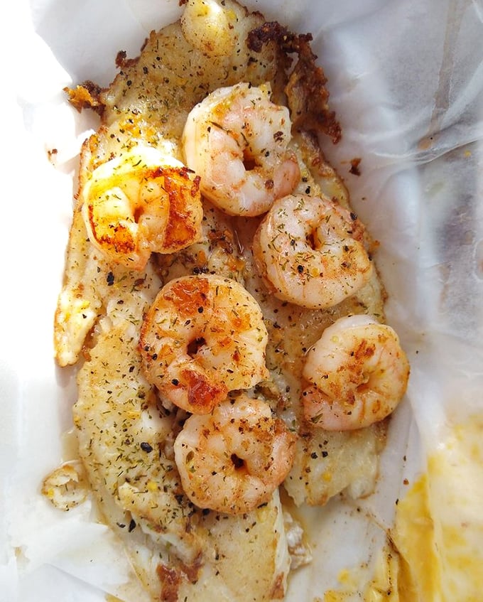 Perfectly seasoned shrimp lounging on a bed of delicate fish – the beach vacation your taste buds have been dreaming about.