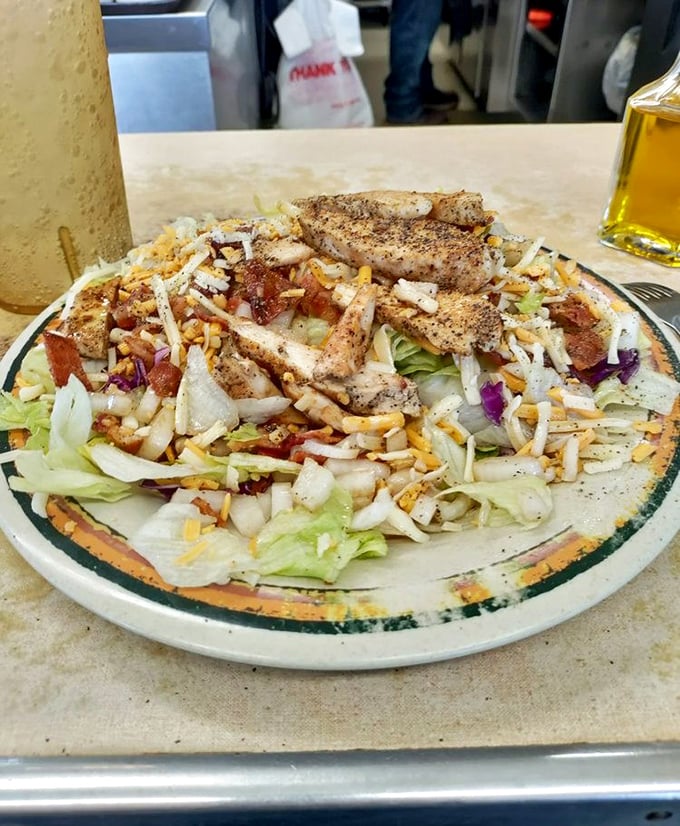 Even salads get the royal treatment here, with grilled chicken crowning fresh greens like edible jewelry.