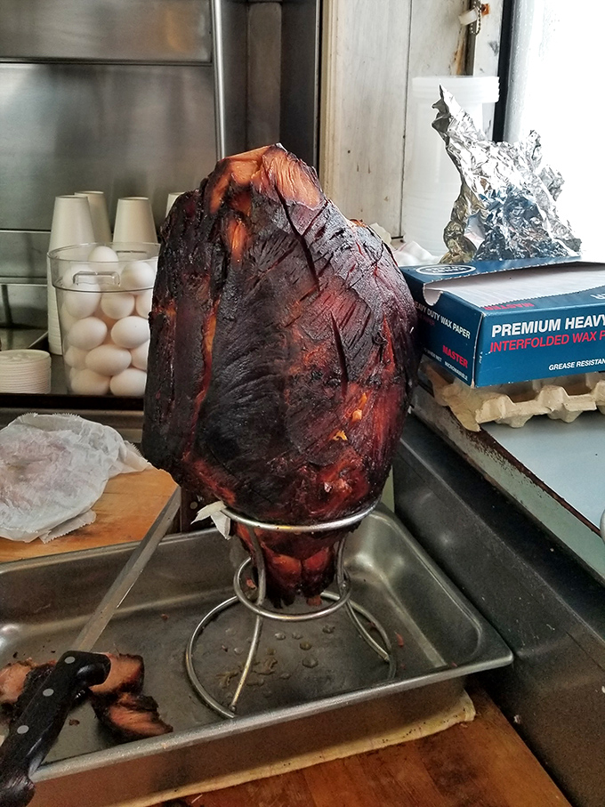 The star of the show in its natural habitat – a gloriously glazed ham that's been perfected over decades, not Instagram trends.
