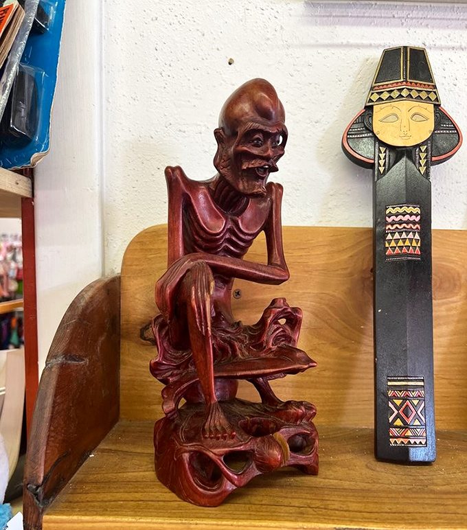 Conversation starters aren't bought—they're discovered, like these carved wooden figures that defy ordinary home décor conventions.